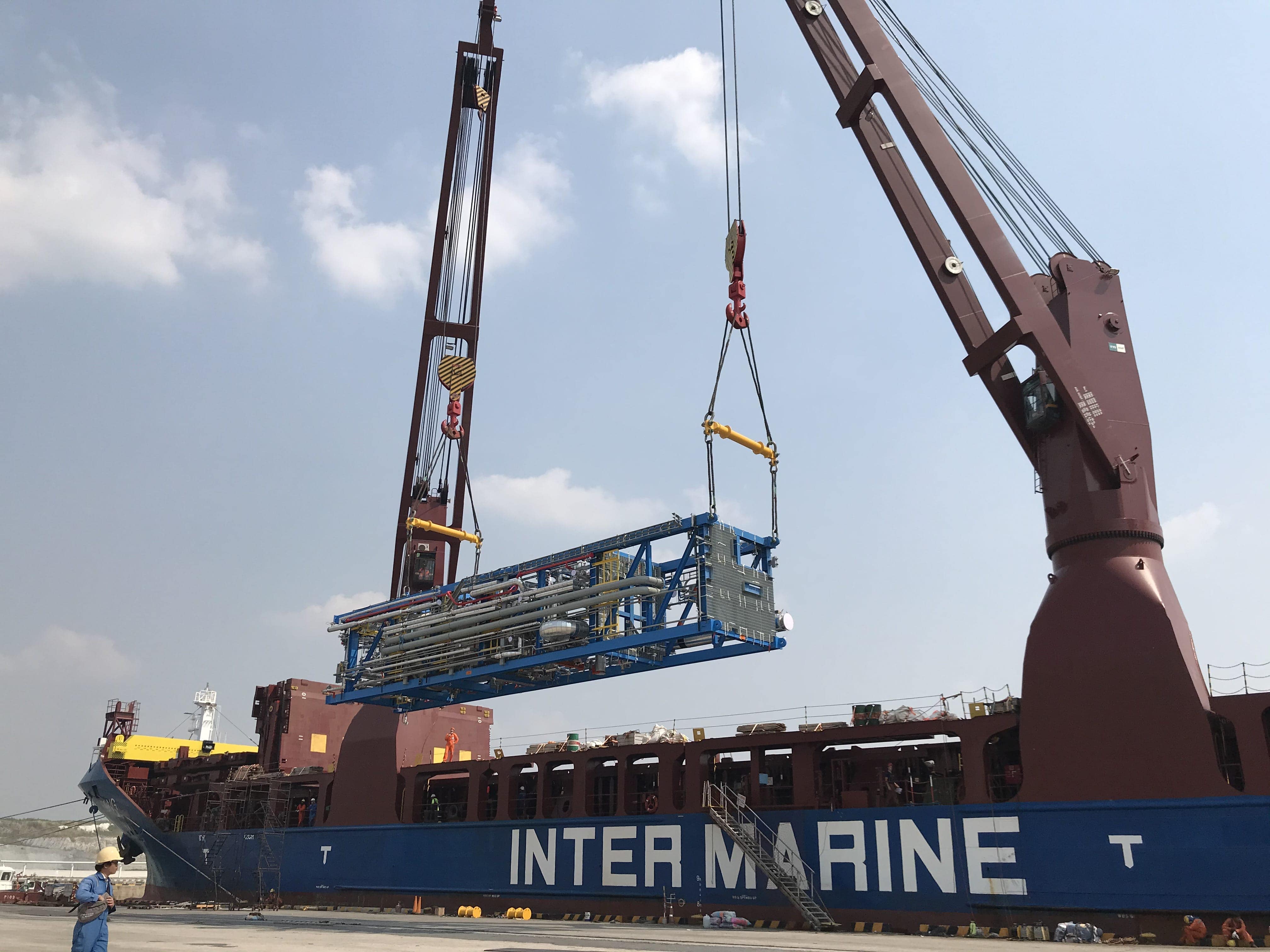 Around the world for a world-scale project: Modularization of process ...